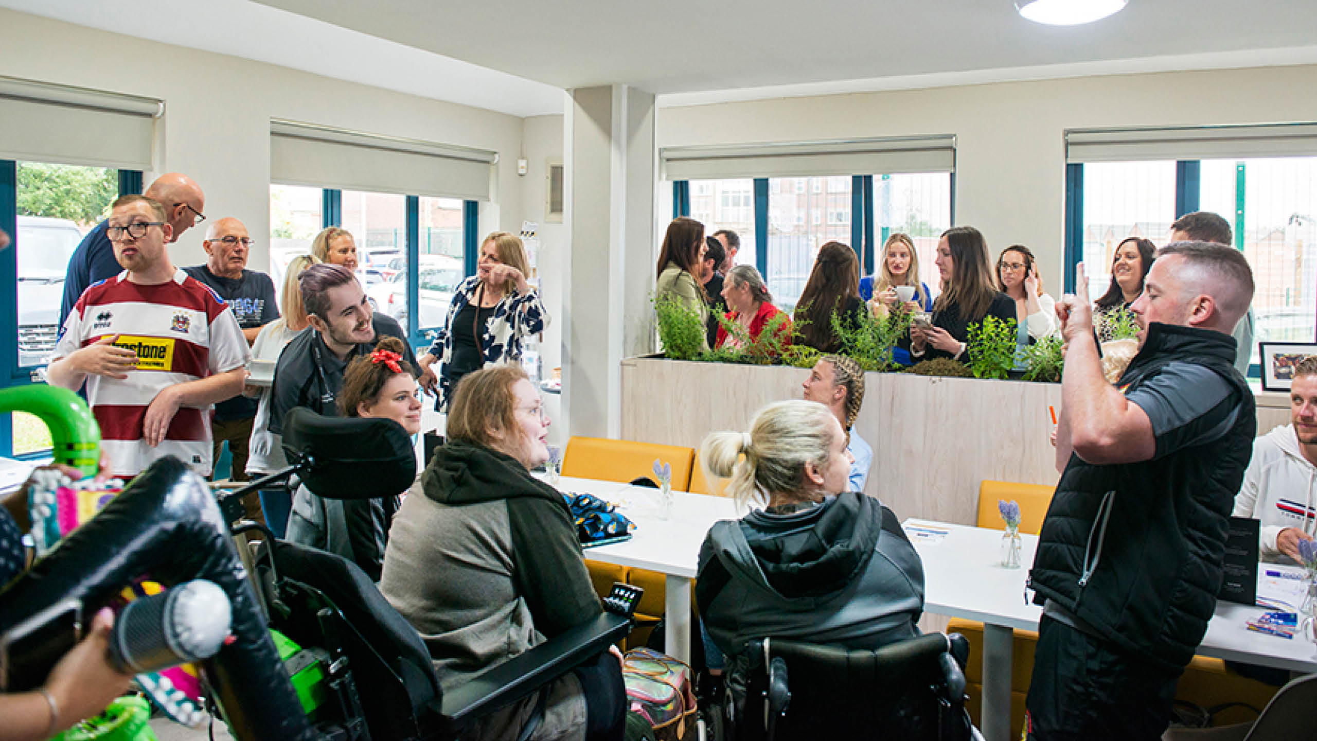 Amspec cuts the ribbon for the grand opening of Embrace's new Community ...