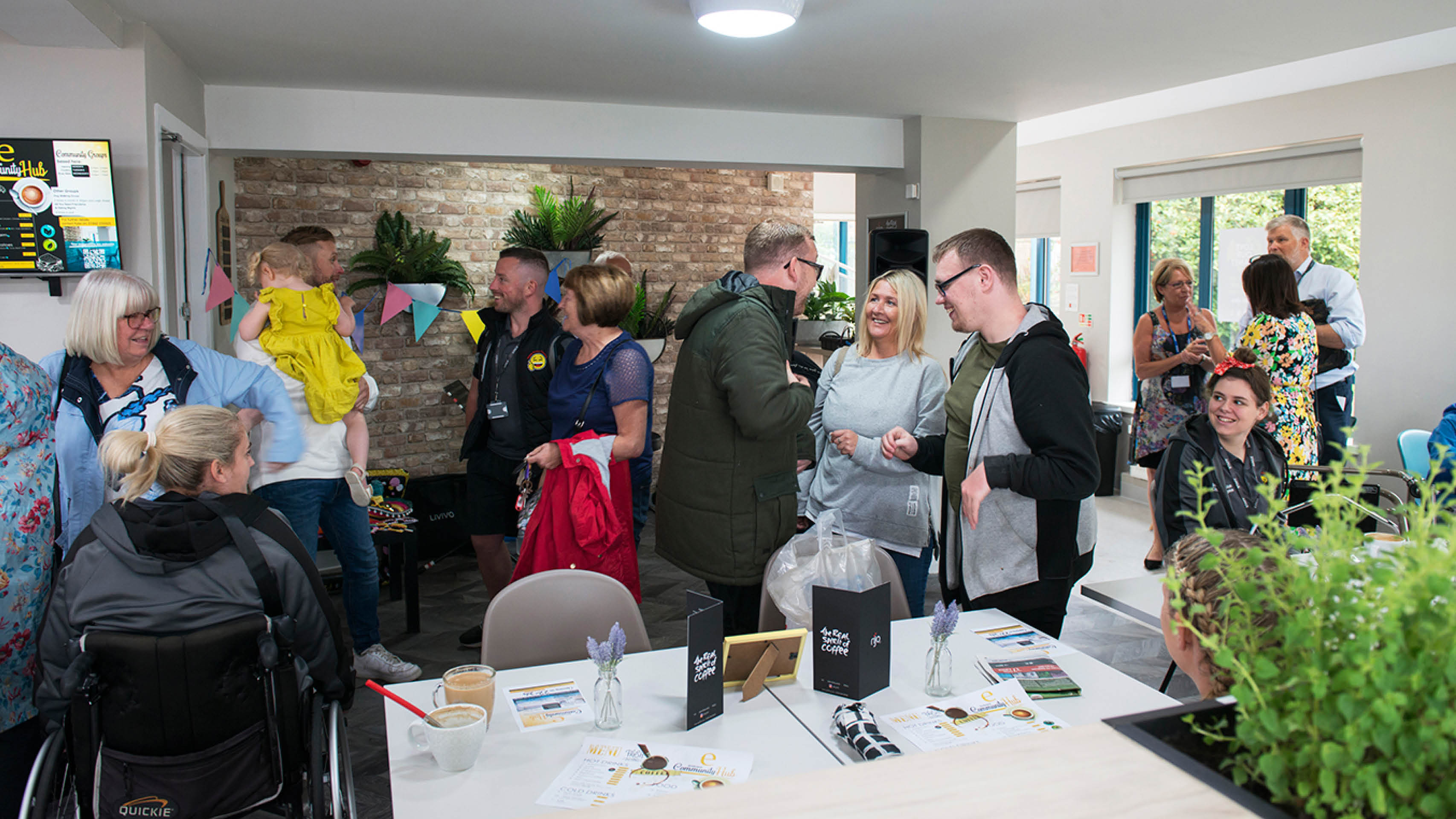 Amspec cuts the ribbon for the grand opening of Embrace's new Community ...