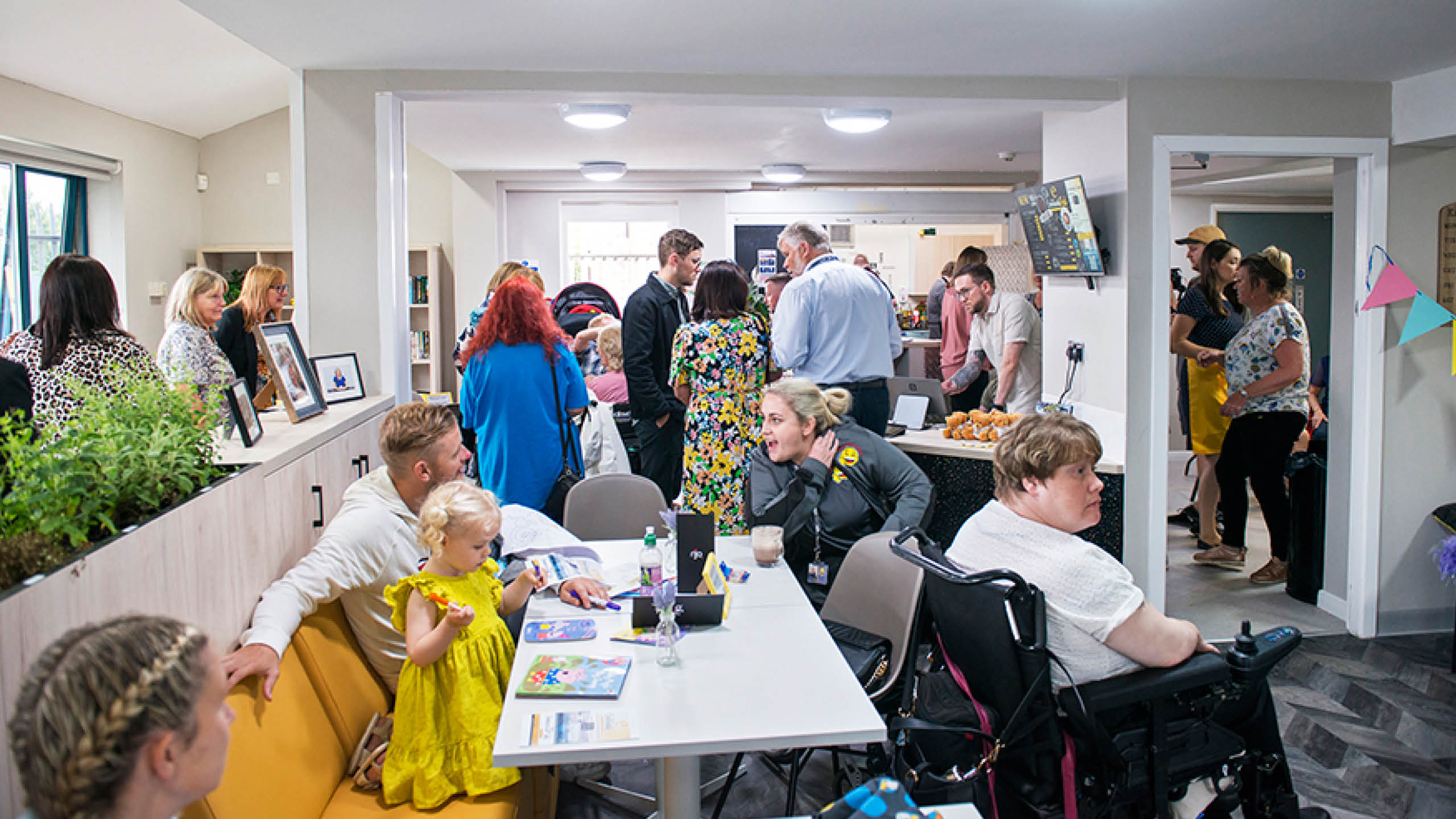 Amspec cuts the ribbon for the grand opening of Embrace's new Community ...