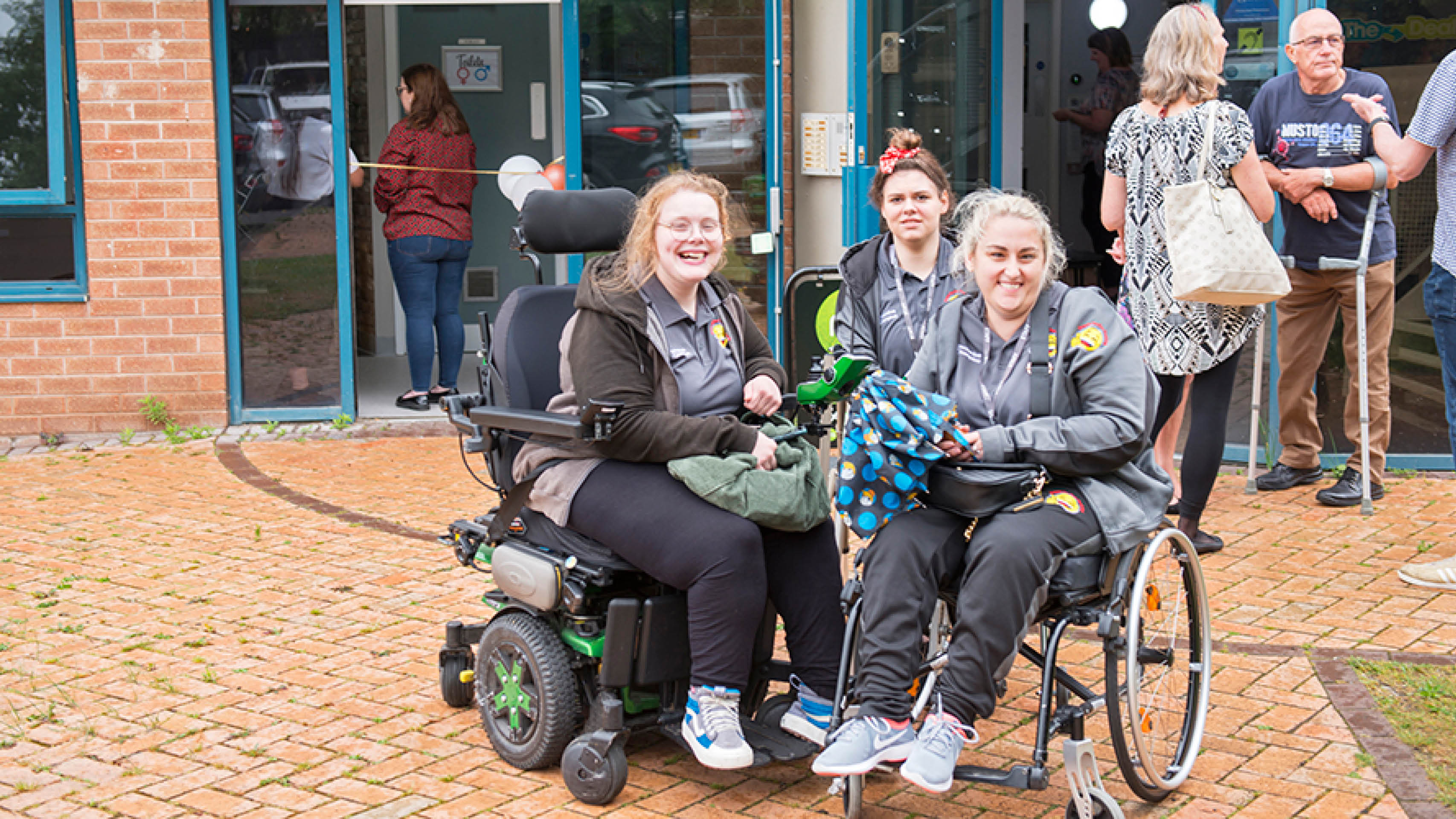 Amspec cuts the ribbon for the grand opening of Embrace's new Community ...