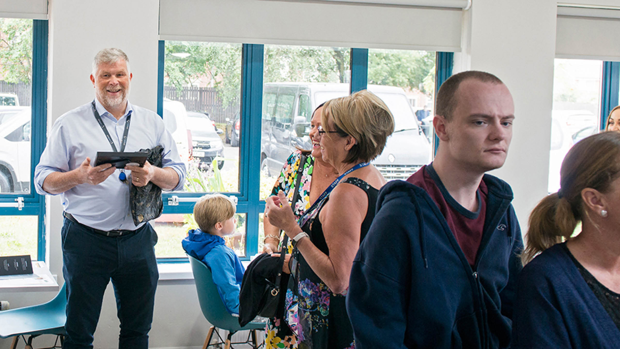 Amspec cuts the ribbon for the grand opening of Embrace's new Community ...